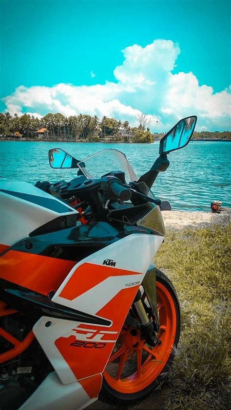 Orange And White Motorcycle By The Water Rc200 Wallpaper
