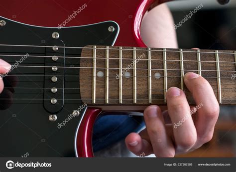 Close View Hand Pressing Strings Electric Guitar Neck Joint Unrecognizable Stock Photo