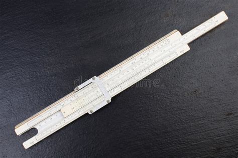 Logarithmic Ruler On Black Background Stationery For Engineers And Logarithmic Ruler On Black Background Stationery For Engineers And