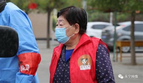 【疫情防控 有你有我】 望洪镇：“微笑大妈”助力疫情防控 贡献红色志愿正能量澎湃号·政务澎湃新闻 The Paper