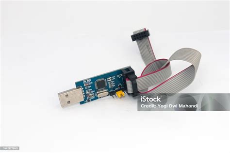 An Avr Microcontroller Downloader With Usb Port And Connecting Cable Isolated On White