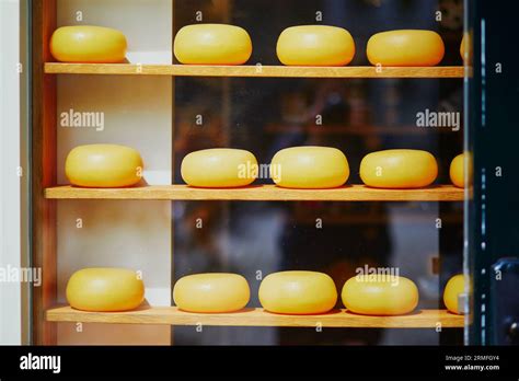 Many wheels of delicious Dutch cheese on shop-window in Amsterdam, the Netherlands Stock Photo ...