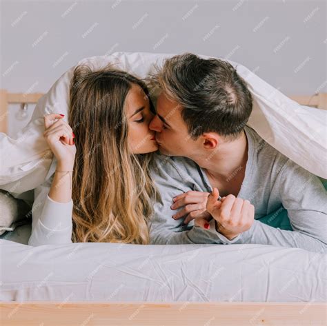 Free Photo Beautiful Couple Kissing On Bed