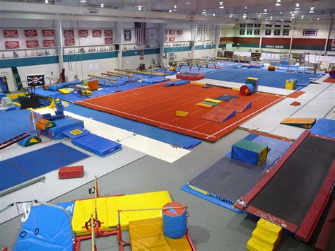 Gymnastics Facility With Trampoline Gym And Colorful Mats Gymnastics
