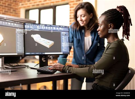 African American Artist Discussing Geometry Error With Coworker