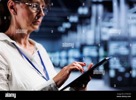 Aged It Professional Using Tablet Ensuring Valuable Data Remains