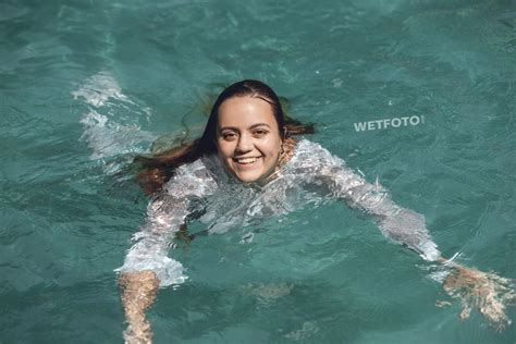 Fully Clothed Girl In White Jeans And Shirt Get Completely Wet In The Pool