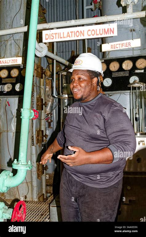 Male Guide Explains Process To Make Rum Analyzer Distillation Column