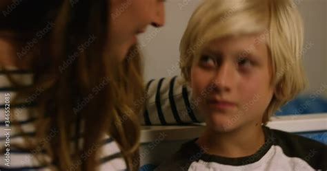 4k Close Up Of Caring Mother Kissing Her Son After She Finishes Reading