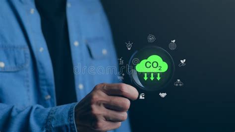 Reduce Co2 Emission Concept Man Holding A Magnifying With