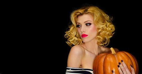 Premium Photo Happy Halloween Serious Blonde Girl With Jackolantern