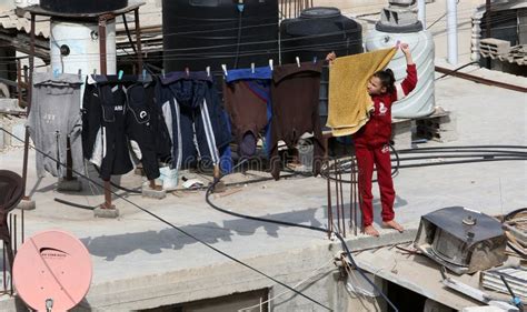 Palestinian Girl Stands On The Roof Of Their House In The Khan Yunis