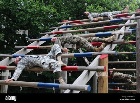 Soldiers Attending The Air Assault Course Engage In The Obstacle