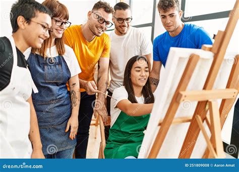 Group Of People Smiling Happy And Looking Draw Of Partner At Art Studio