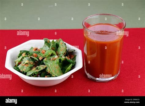 Healthy Spinach Salad Meal With Diced Vegetables And Vegetable Juice