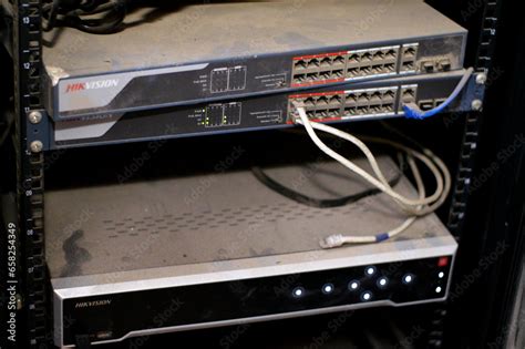 Cairo, Egypt, October 3 2023: HikVision NVR device and network switch ...