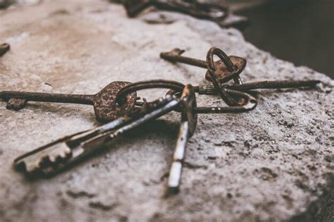 Premium Photo Close Up Of Rusty Keys On Rock