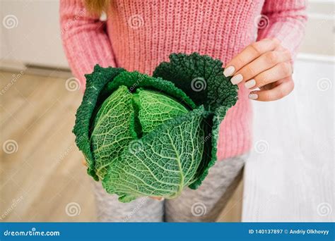 The Girl Keeps The Cabbage Young Woman With Cabbage Stock Image