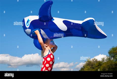 Girl Holding Inflatable Whale Outdoors Stock Photo Alamy