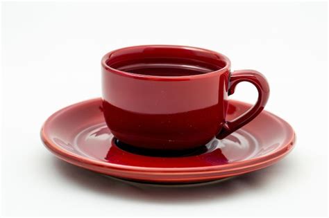 A Red Tea Cup With A Red Plate Premium Ai Generated Image
