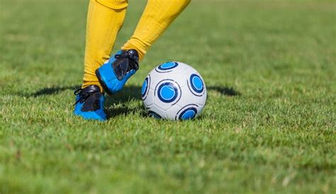 Premium Photo Low Section Of Person Playing Soccer On Field