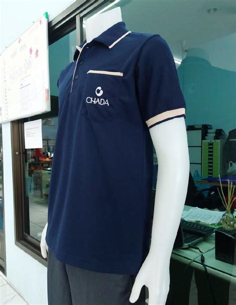เสื้อโปโลสีกรม แขนจั้ม เนื้อผ้า Tk มีกระเป๋าอกปักอกซ้ายและด้านหลัง