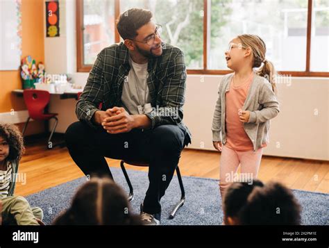 Are You Ready To Speak In Front Of The Class Confident Little Stands Next To Her Teacher Ready
