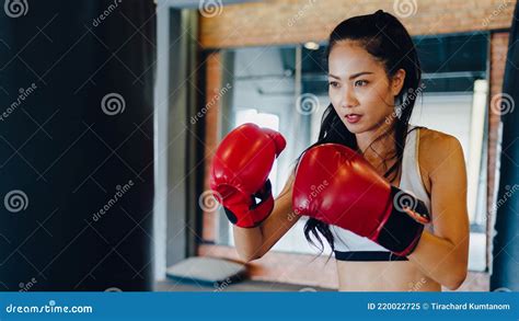 Young Asia Lady Kickboxing Exercise Workout Punching Bag Tough Female