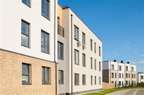 Premium Photo Perspective Of Long White Three Storey Block Of Flats