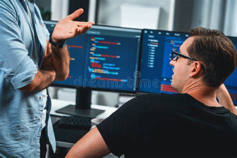 It Developers Discussing Online Software Development Information