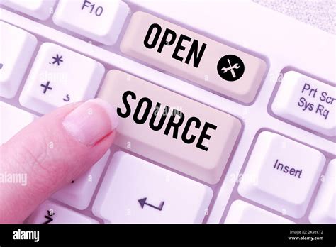 Text Sign Showing Open Source Word Written On Contains The Source Code That Can Be Modified And