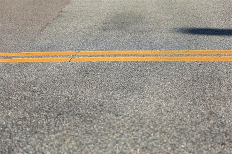 Premium Photo Double Yellow Line Streets Symbolize Traffic Regulation