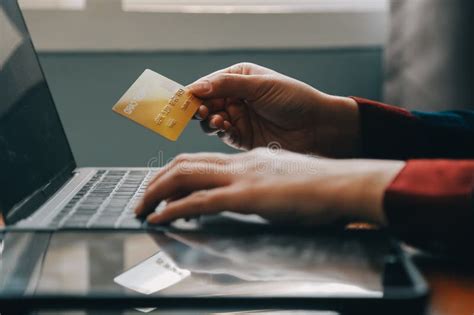 Close Up Of Woman Hand Using Credit Card And Laptop For Payment And