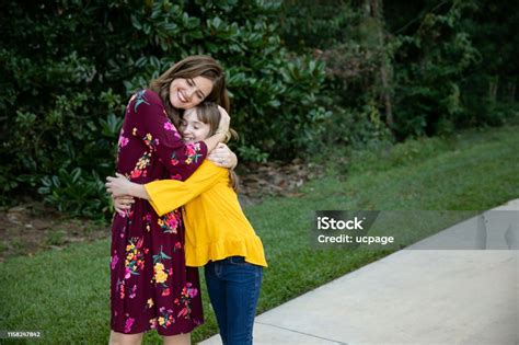 Preadolescent Tween Girl In A Yellow Top Outside In Her Backyard Stock