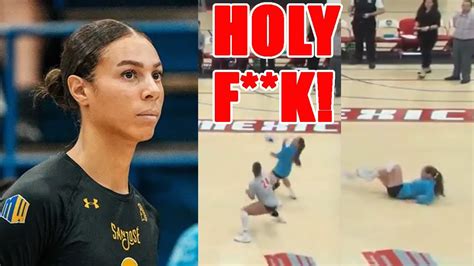 Crowd Shocked Trans Volleyball Player Blaire Fleming Spikes The Ball Into Another Females Body
