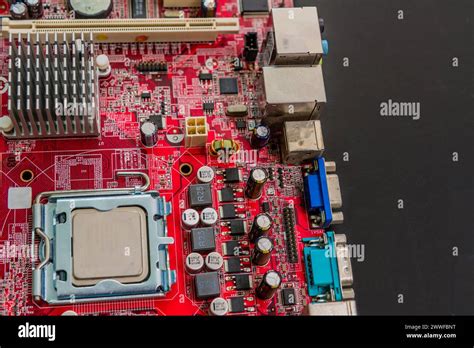 Closeup Of Computer Mother Board With Installed Cpu On Black Counter