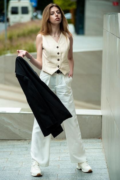 Premium Photo Portrait Of A Beautiful Girl In A Business Suit In The City