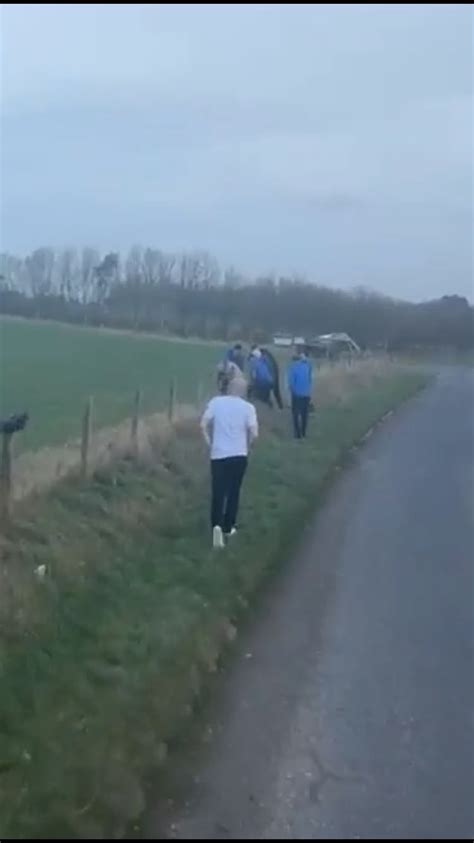 Clitheroe Fc Manager Billy Priestly Helping A Sheep That Had Been Stuck In Barbed Wire On Their
