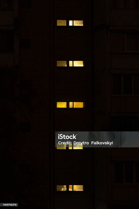 A Vertical Row Of Narrow Rectangular Windows Of A Highrise Residential