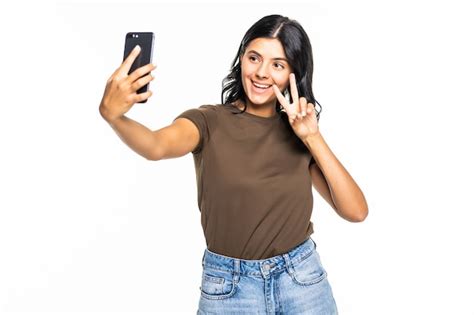 Free Photo Happy Flirting Young Girl Taking Pictures Of Herself At