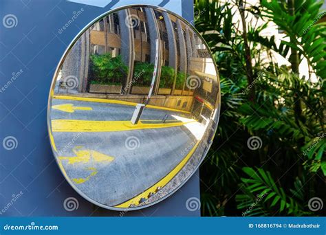 Traffic Mirror At The Driveway Of An Underground Parking Garage Stock