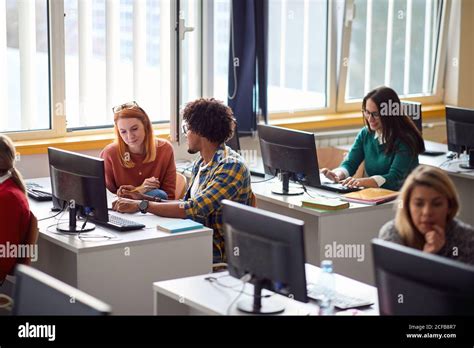 Male And Female Learning Together In Classroom Stock Photo Alamy