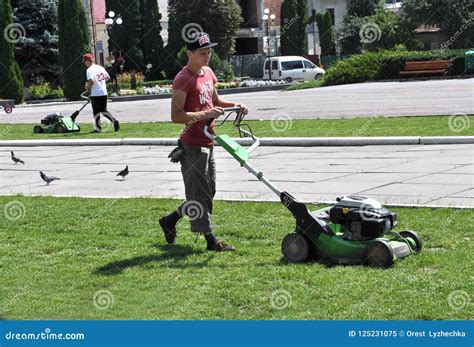 Young Workers Cut The Grass Editorial Image Image Of Service