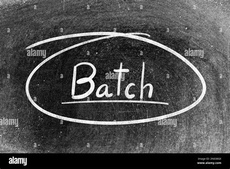 white chalk hand writing in word batch and circle shape on blackboard