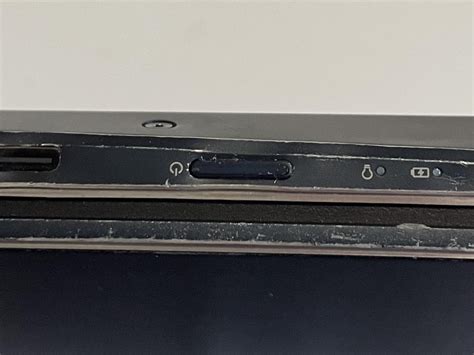 Side Panel Dented And Power Button Is Jammed Rendering Laptop Unusable