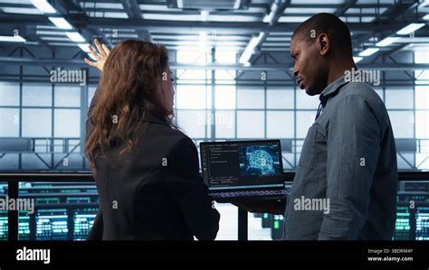 Software Developers Using Ai Tech On Laptop In Data Center Managing Server Virtualization It