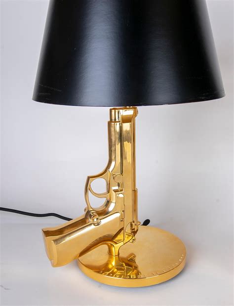 Pair Of Flos Guns Collection Table Lamps In Gold By Philippe Starck For