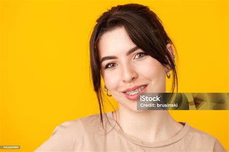 Closeup Studio Portrait Of A Cheerful 20 Year Old White Woman With