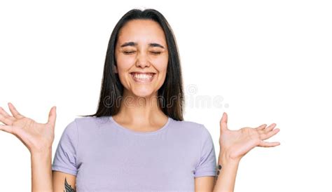 Young Hispanic Woman Wearing Casual Clothes Celebrating Mad And Crazy