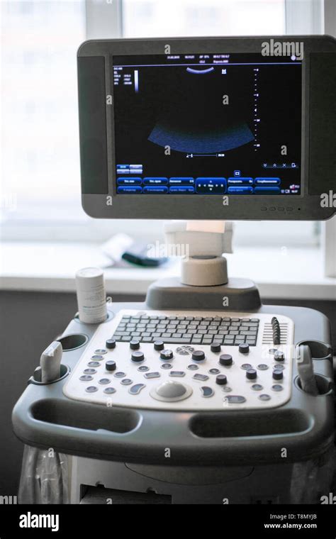 Close Up In Backlit High Tech Ultrasound Machine Analysis Diagnosis Of The Condition Of The